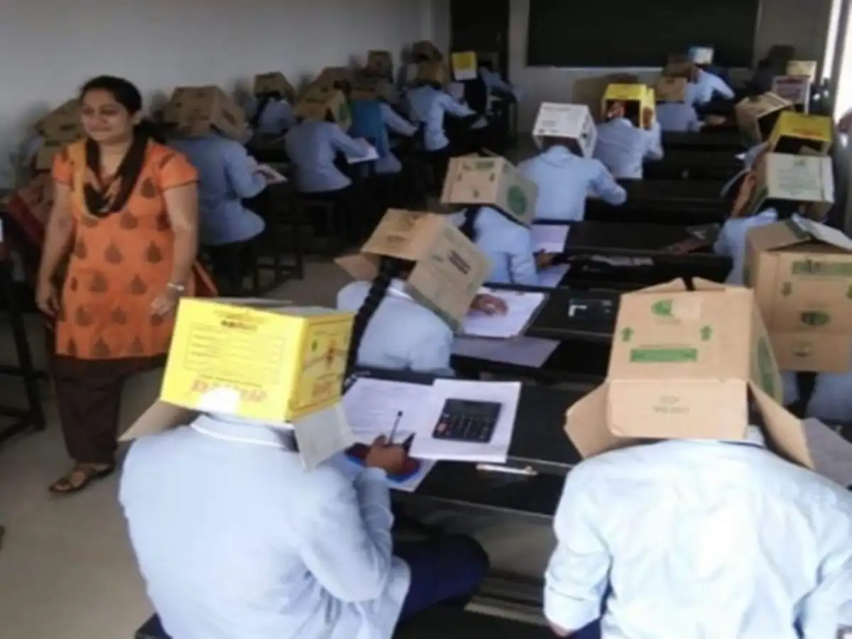Cardboard Boxes On Students Heaad,தலையில் அட்டைப்பெட்டியுடன் தேர்வு ...