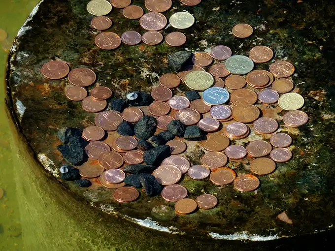 Throwing Coins Into Water Benefits